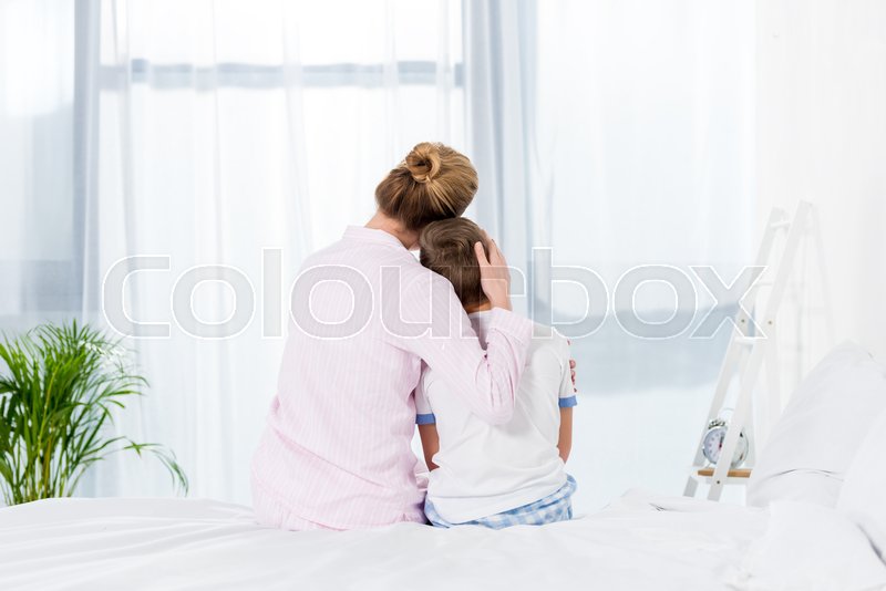 Rear View Of Mother And Son Embracing Stock Image Colourbox