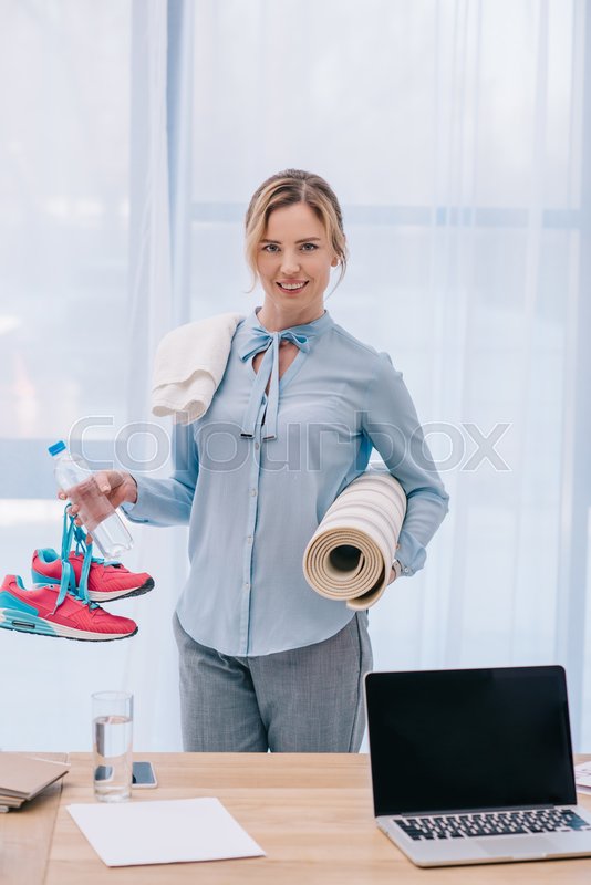 Sporty businesswoman with fitness ... | Stock image | Colourbox