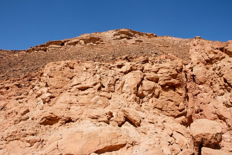 Red rocky hill in the desert landscape | Stock image | Colourbox