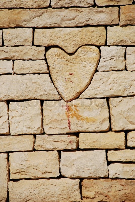 Stone heart in the stoney brick wall | Stock image | Colourbox