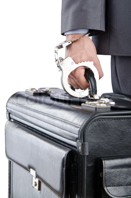 Man with briefcase and handcuffs | Stock image | Colourbox
