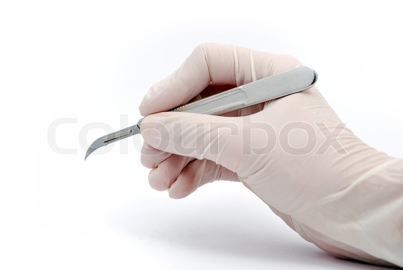 Medical scalpel in the hands of the ... | Stock image | Colourbox