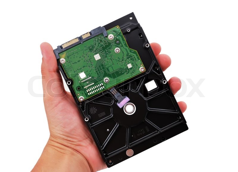 Hard drive in hand on a white ... | Stock image | Colourbox