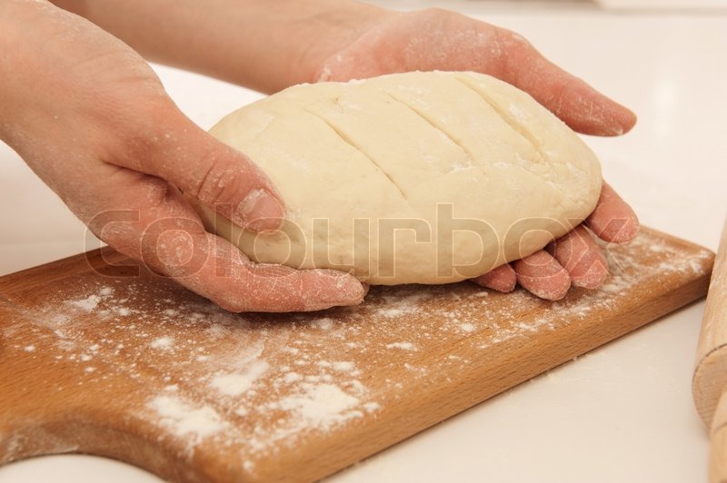 Female cook shaping dough for baking ... | Stock image | Colourbox