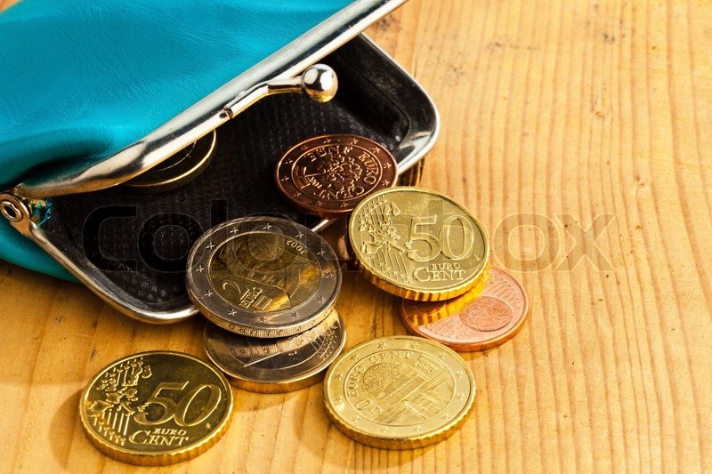 An empty wallet with a few euro coins ... | Stock image | Colourbox
