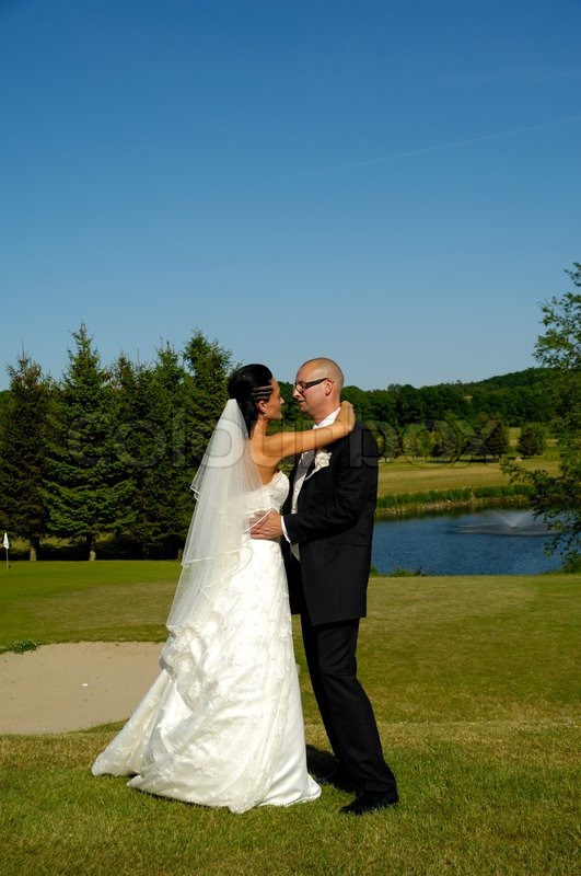 Wedding couple holding eachother | Stock image | Colourbox