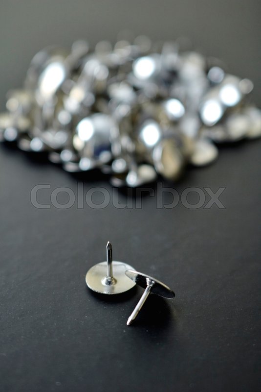 A studio photo of drawing pins | Stock image | Colourbox
