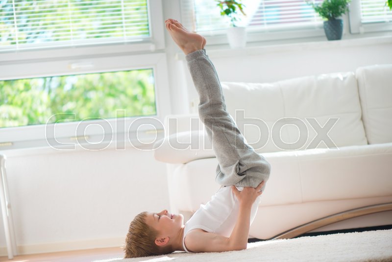 Happy little boy exercising sport at ... | Stock image | Colourbox