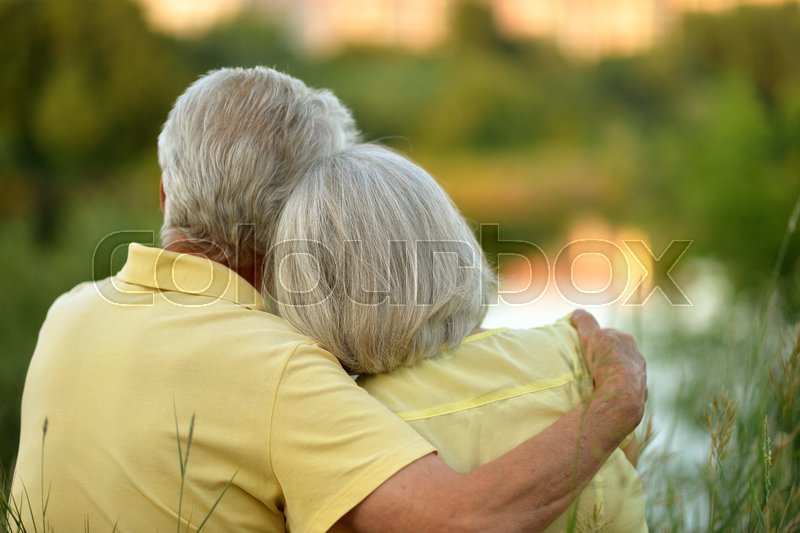 Rear view of senior couple hugging in ... | Stock image | Colourbox