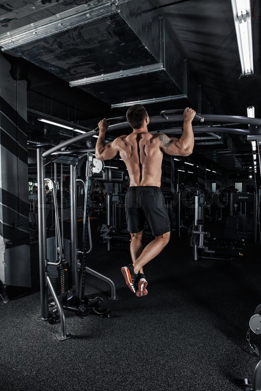 Back view of muscular man doing pull up ... | Stock image | Colourbox