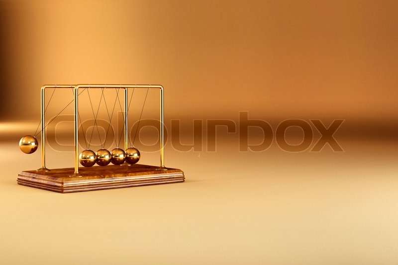 Perpetual motion. Pendulum on yellow ... | Stock image | Colourbox