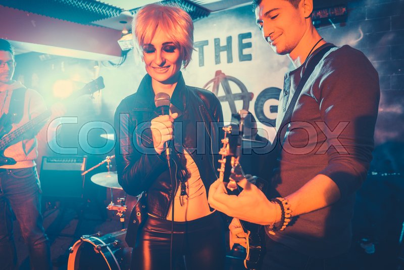 Singer and guitar player on stage ... | Stock image | Colourbox