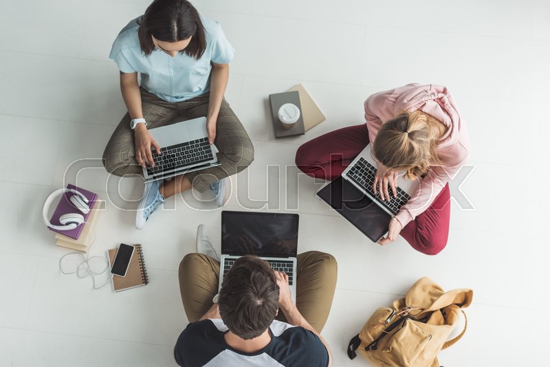 Overhead view of students studying with ... | Stock image | Colourbox