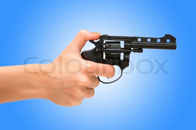Hand holding revolver isolated on the ... | Stock Photo | Colourbox