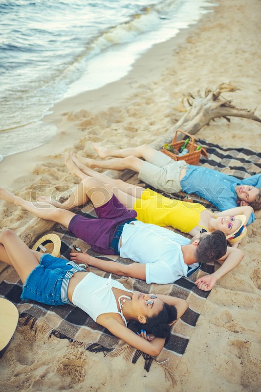 Lying On The Beach With Friends