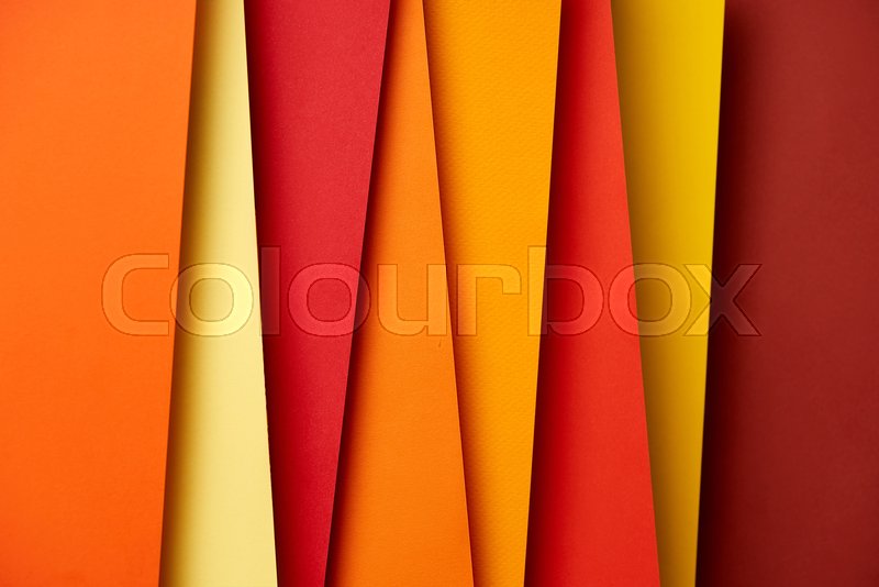 Paper sheets in warm colors background | Stock image | Colourbox