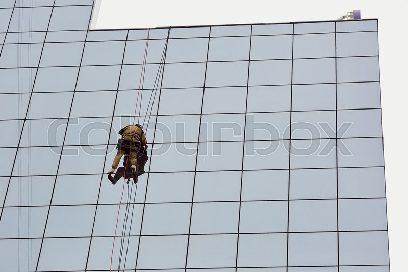 High-altitude work on tall buildings ... | Stock image | Colourbox