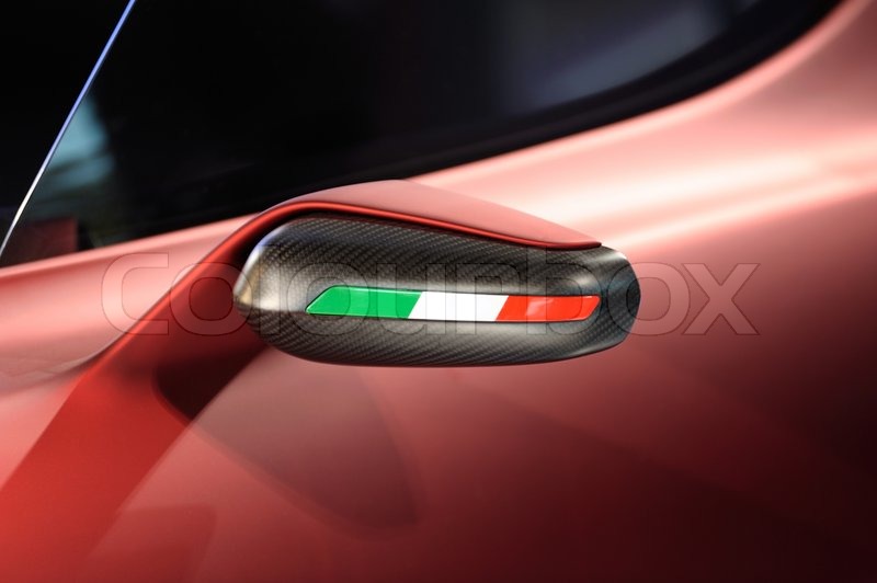 Rearview car driving mirror on an a red ... | Stock image | Colourbox