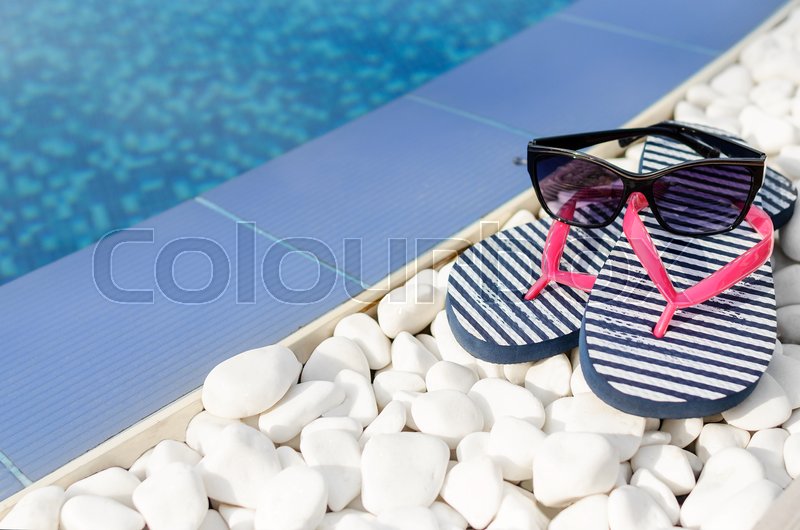 Flip-flops and sunglasses on white ... | Stock image | Colourbox