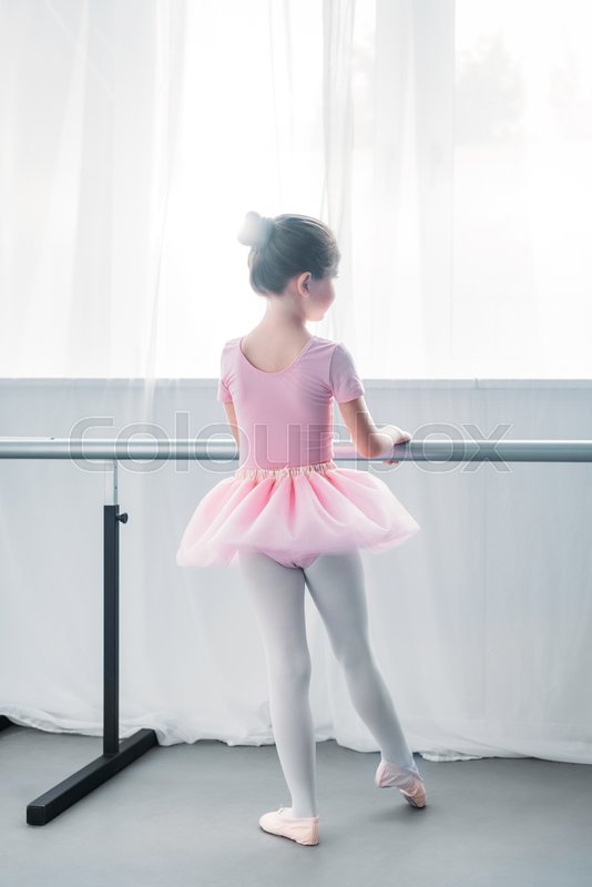 Rear view of little kid in pink tutu ... | Stock image | Colourbox