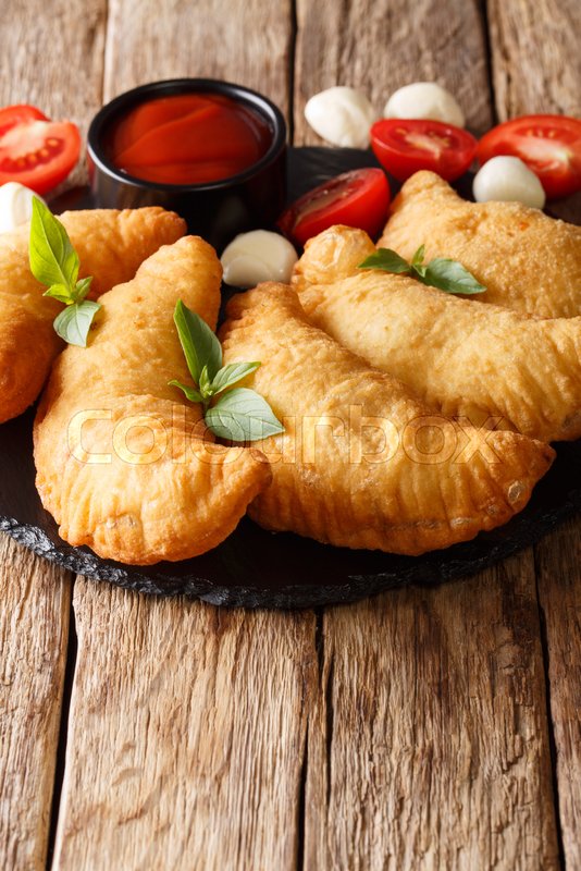 Delicious hot fried panzerotti with ... | Stock image | Colourbox