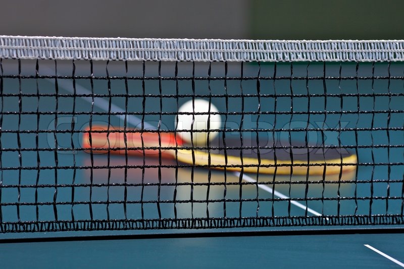 Table tennis ball and racket through ... | Stock image | Colourbox
