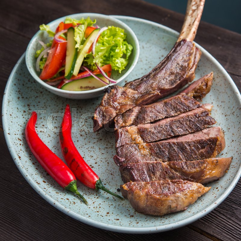 Tomahawk rib steak with fresh ... | Stock image | Colourbox