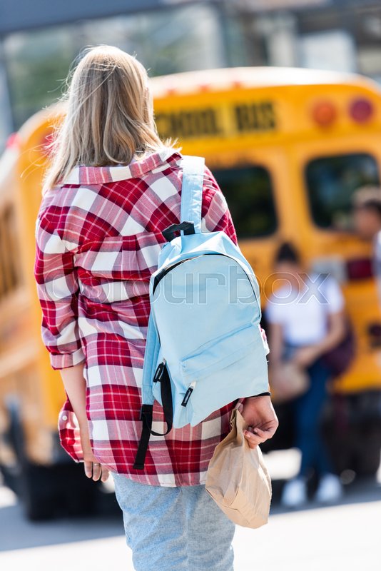 Rear view of teen schoolgirl with ... | Stock image | Colourbox