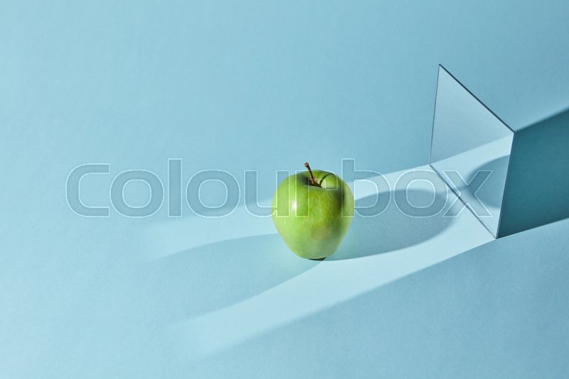 Reflection of the shadow from apple in ... | Stock image | Colourbox