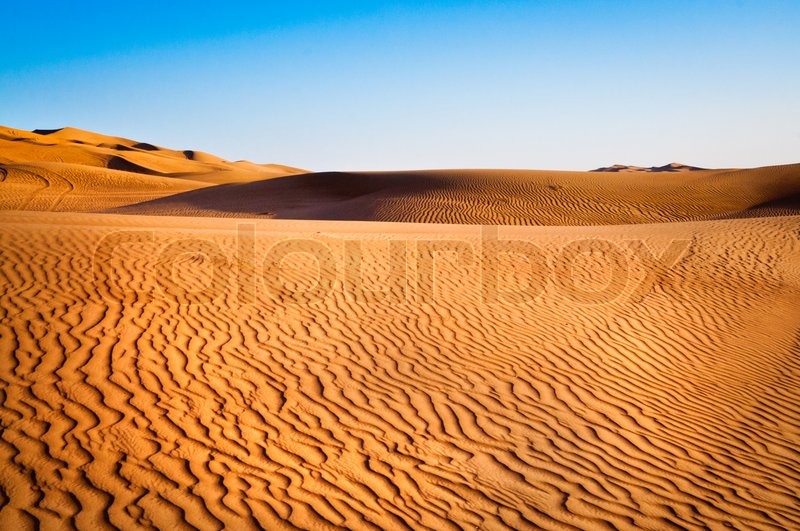 Sandy desert on background of blue sky | Stock image | Colourbox