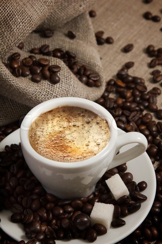 Small cup of strong coffee on a brown ... | Stock image | Colourbox