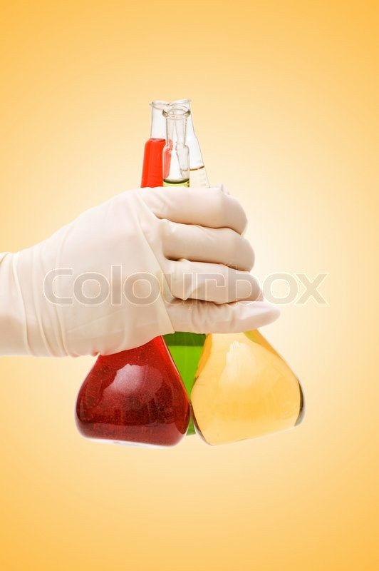 Hand with chemical solutions on ... | Stock image | Colourbox