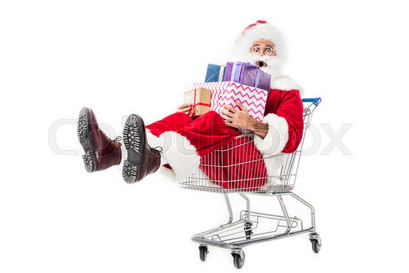 Shocked santa claus holding pile of ... | Stock image | Colourbox