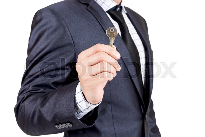 Businessman holding keys isolated on ... | Stock image | Colourbox