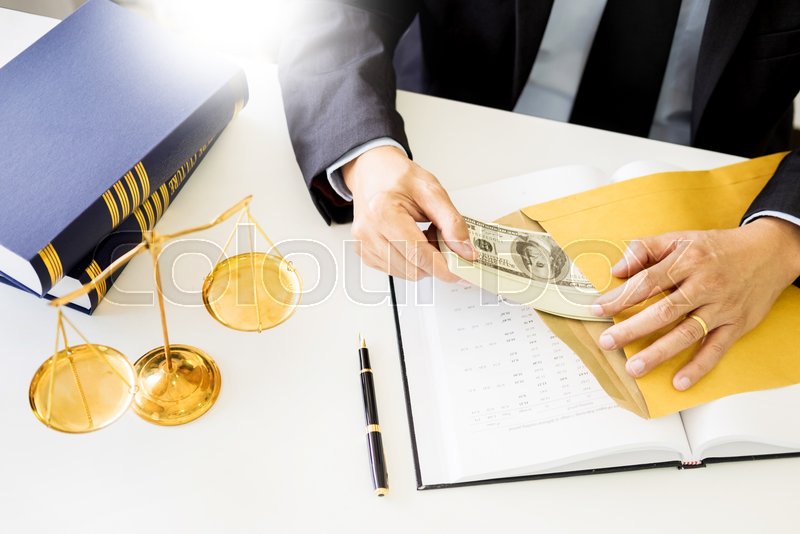 Lawyer being offered receiving money as ... | Stock image | Colourbox