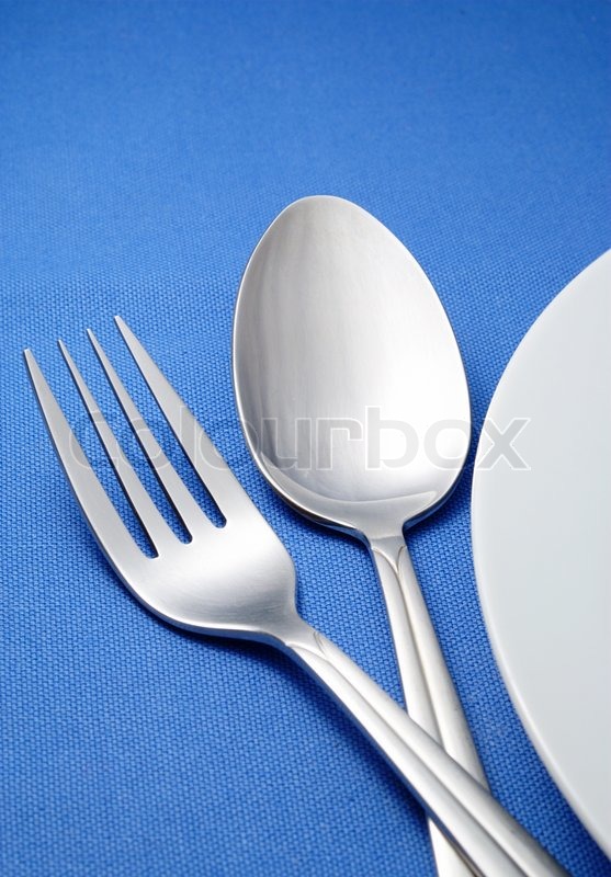 Gabel, Löffel und Untertasse auf einem ... | Stock Bild | Colourbox