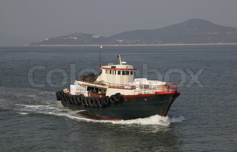Fishing boat heading out to the ocean | Stock image | Colourbox