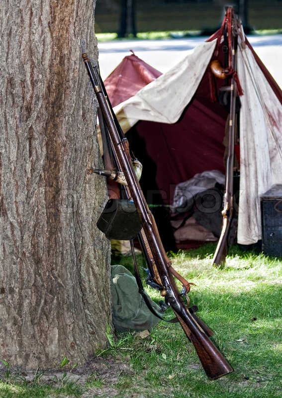 Old style Gun leaning on tree | Stock image | Colourbox
