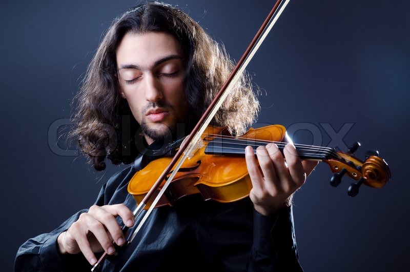 Young violin player playing | Stock Photo | Colourbox