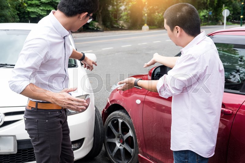 Two men arguing after a car accident ... | Stock image | Colourbox