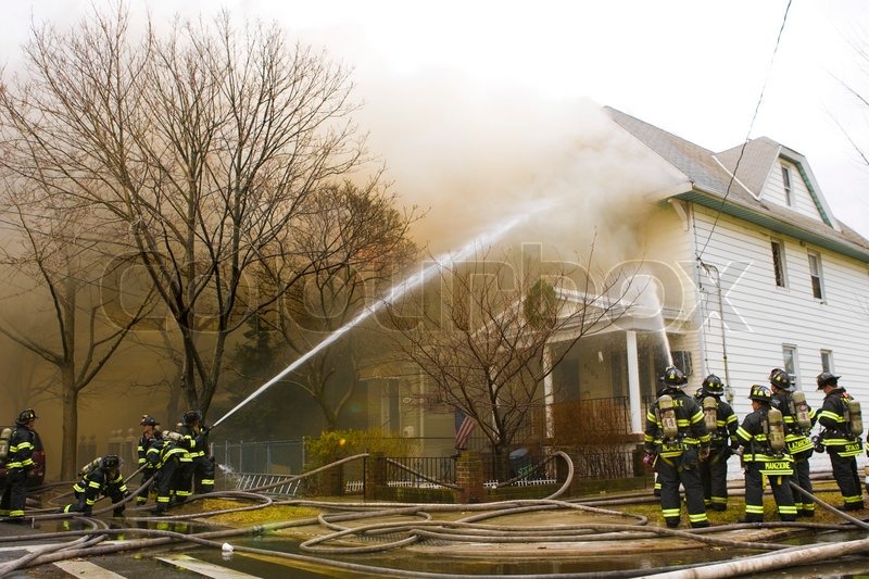 Firemen at work putting out a house ... | Stock image | Colourbox