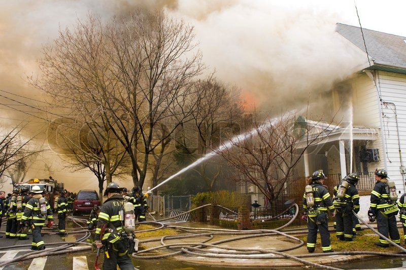 Firemen at work putting out a house ... | Stock image | Colourbox