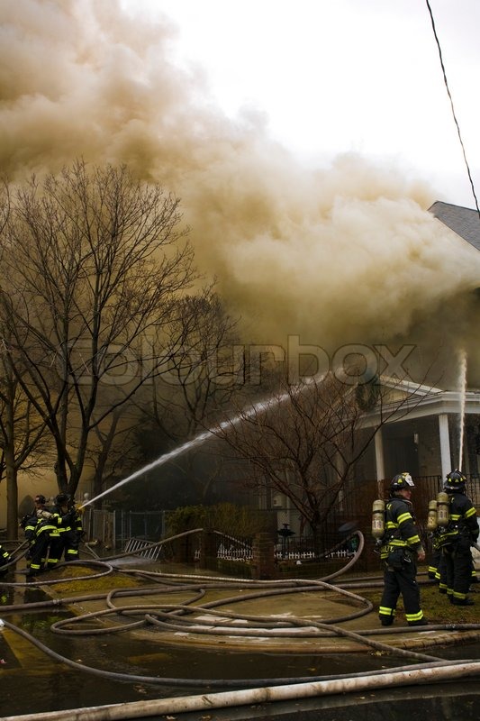 Firemen at work putting out a house ... | Stock image | Colourbox