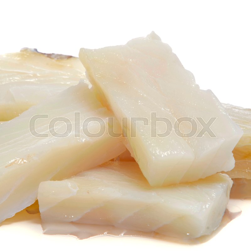 Some pieces of raw cod on a white ... | Stock image | Colourbox
