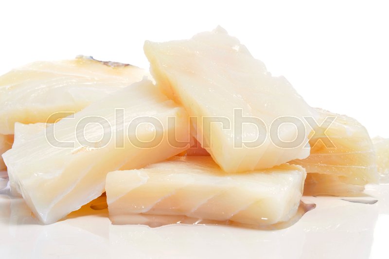 Some pieces of raw cod on a white ... | Stock image | Colourbox
