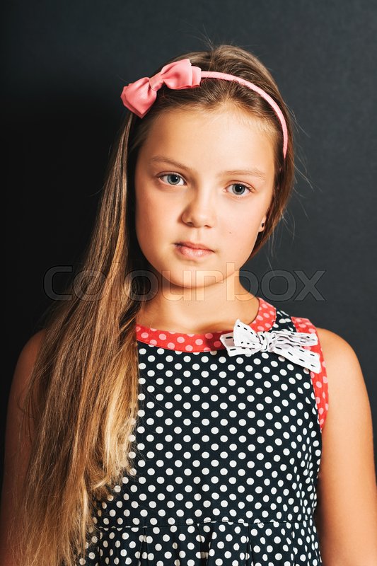 Studio shot of cute little girl wearing ... | Stock image | Colourbox