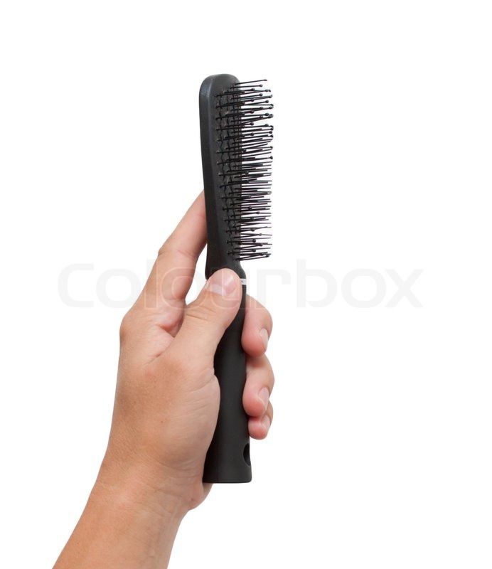 Black comb in his hand on a white ... | Stock image | Colourbox
