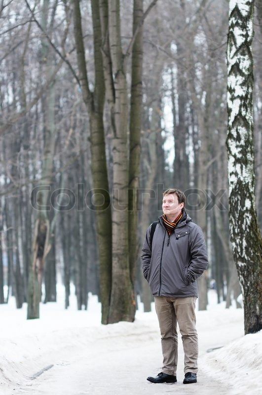 Middle age man walking in spring park | Stock image | Colourbox