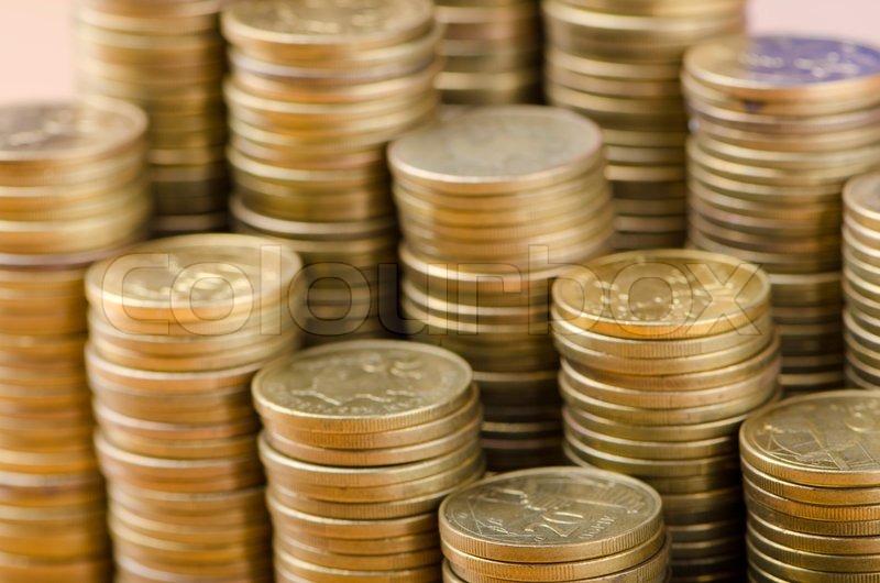 Golden coins in high stacks | Stock Photo | Colourbox