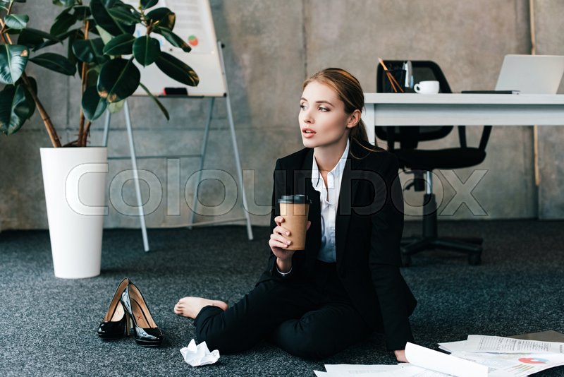 Beautiful businesswoman sitting on ... | Stock image | Colourbox
